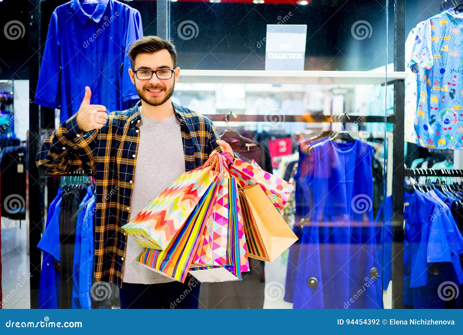 Guy shopping in a mall stock photo. Image of consumer - 94454392