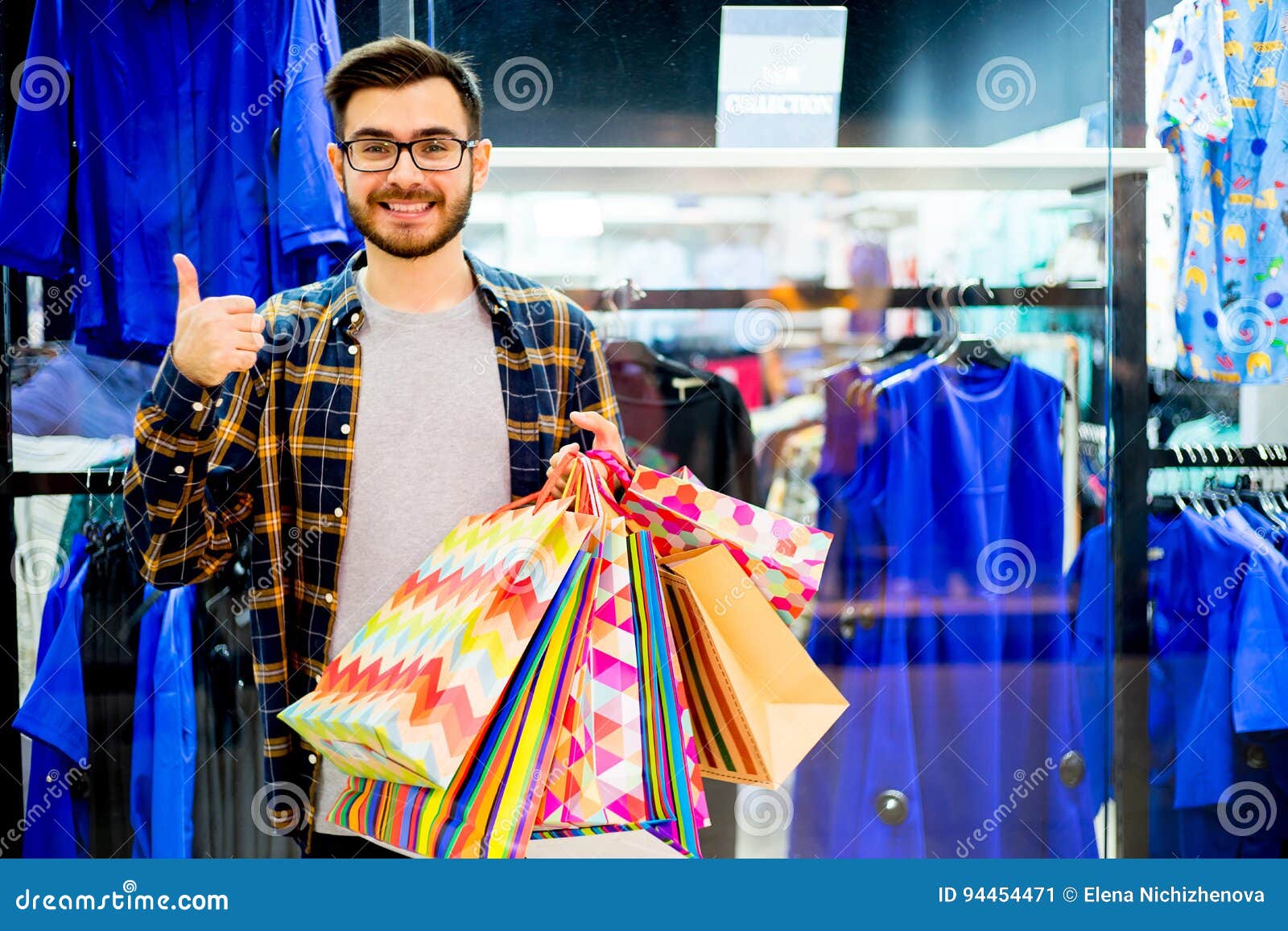 Guy shopping in a mall stock image. Image of buyer, fashion - 94454471