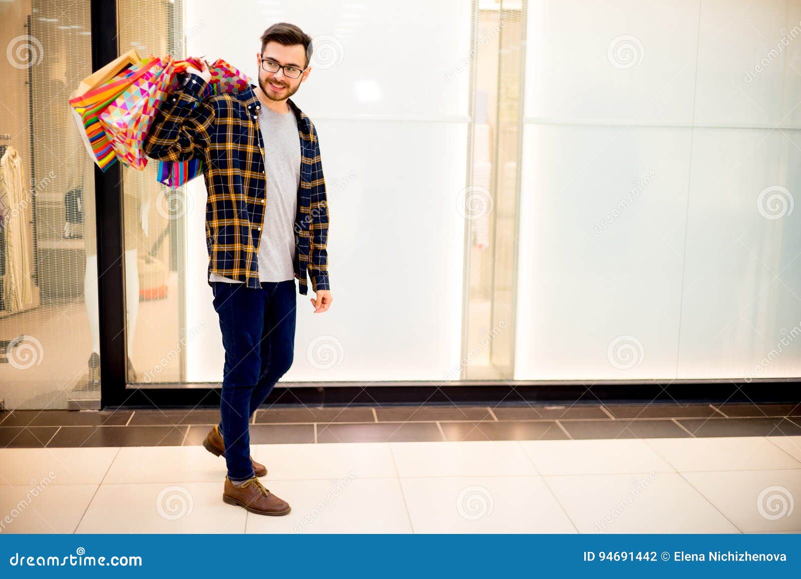 Guy shopping in a mall stock photo. Image of caucasian - 94691442