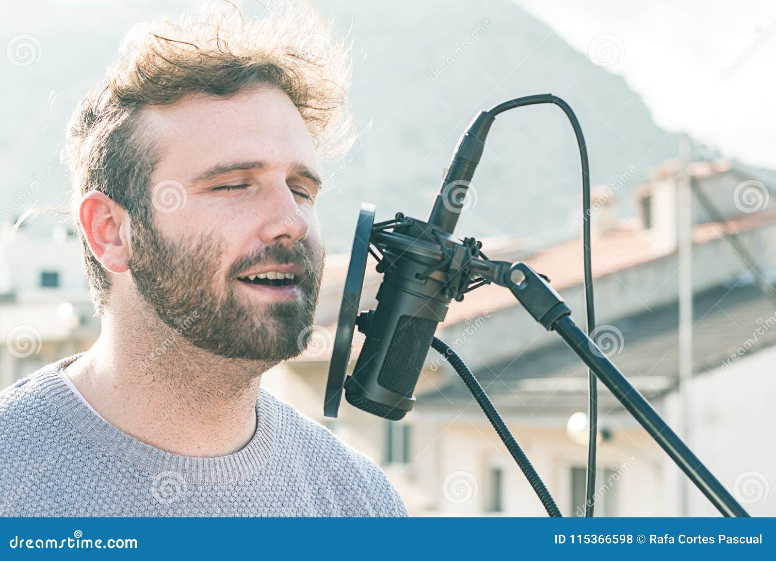Guy singing on a rooftop stock photo. Image of casual - 115366598