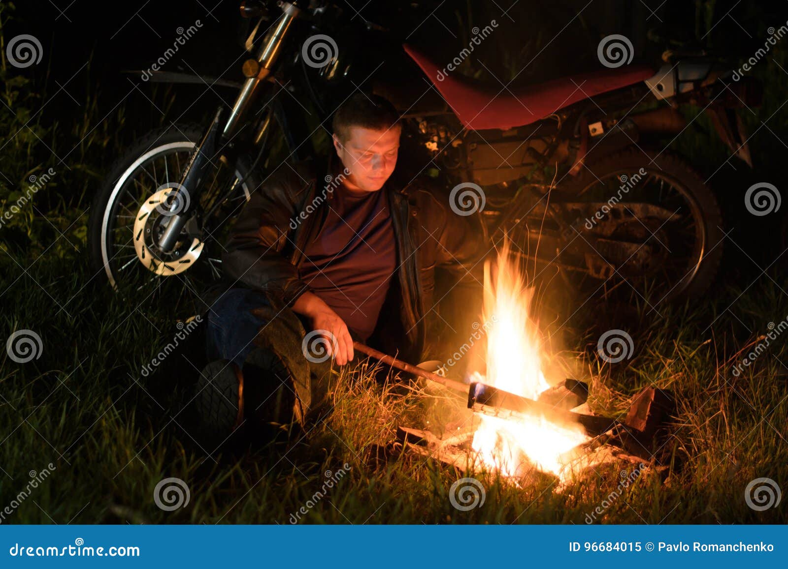 The Guy Sits by the Fire and Motorcycle at Night Stock Image - Image of ...