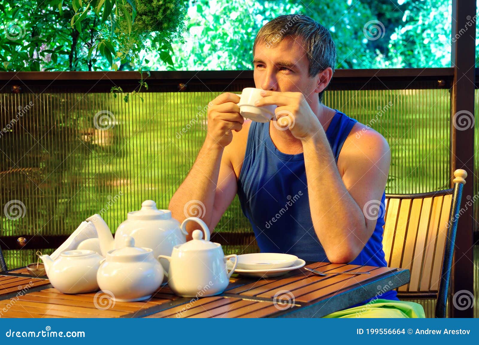 A Guy Sits in a Cafe and Drinking Tea Stock Photo - Image of breakfast ...