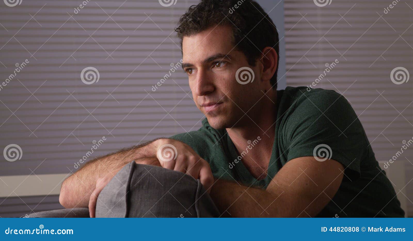 Guy Sitting on Couch Thinking Stock Photo - Image of modern, looking ...