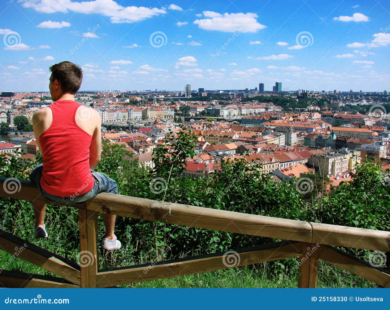 A guy sitting on a fence stock photo. Image of panorama - 25158330