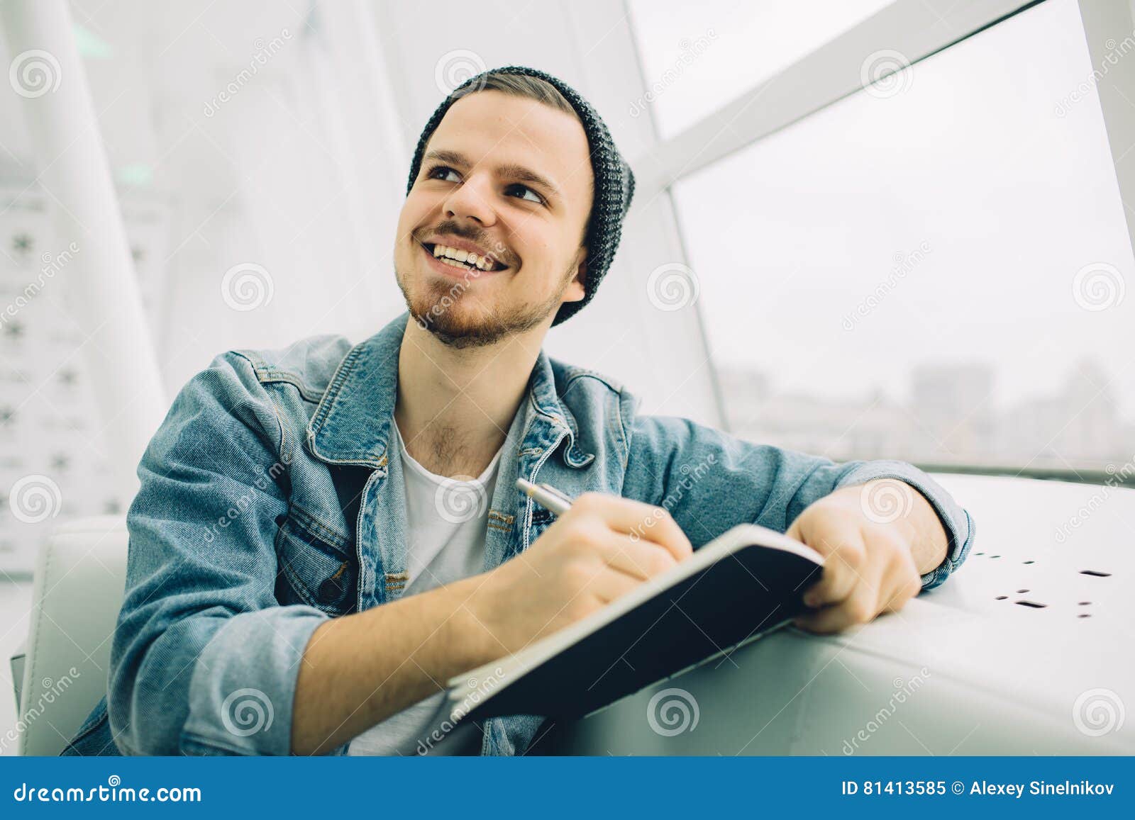 Guy is Sitting on Sofa and Writing Notes Stock Image - Image of ...