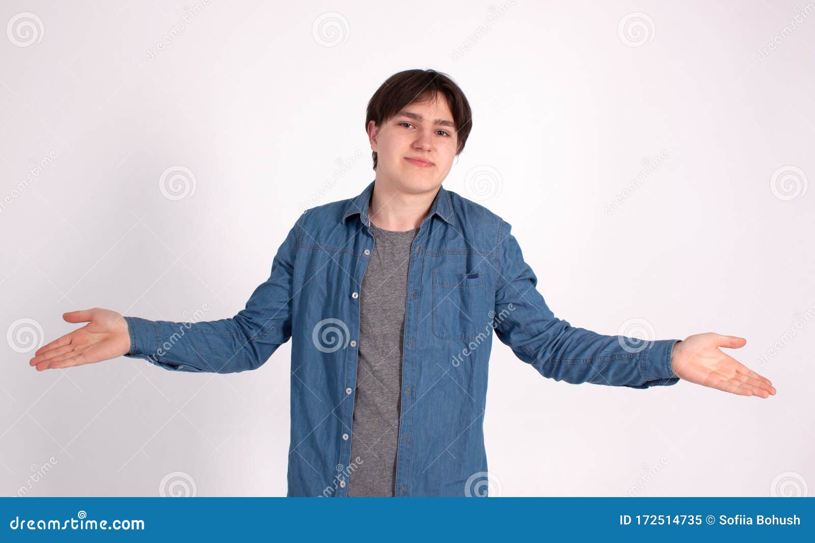 The Guy Spreads His Arms To the Sides with His Palms Up and Looking ...