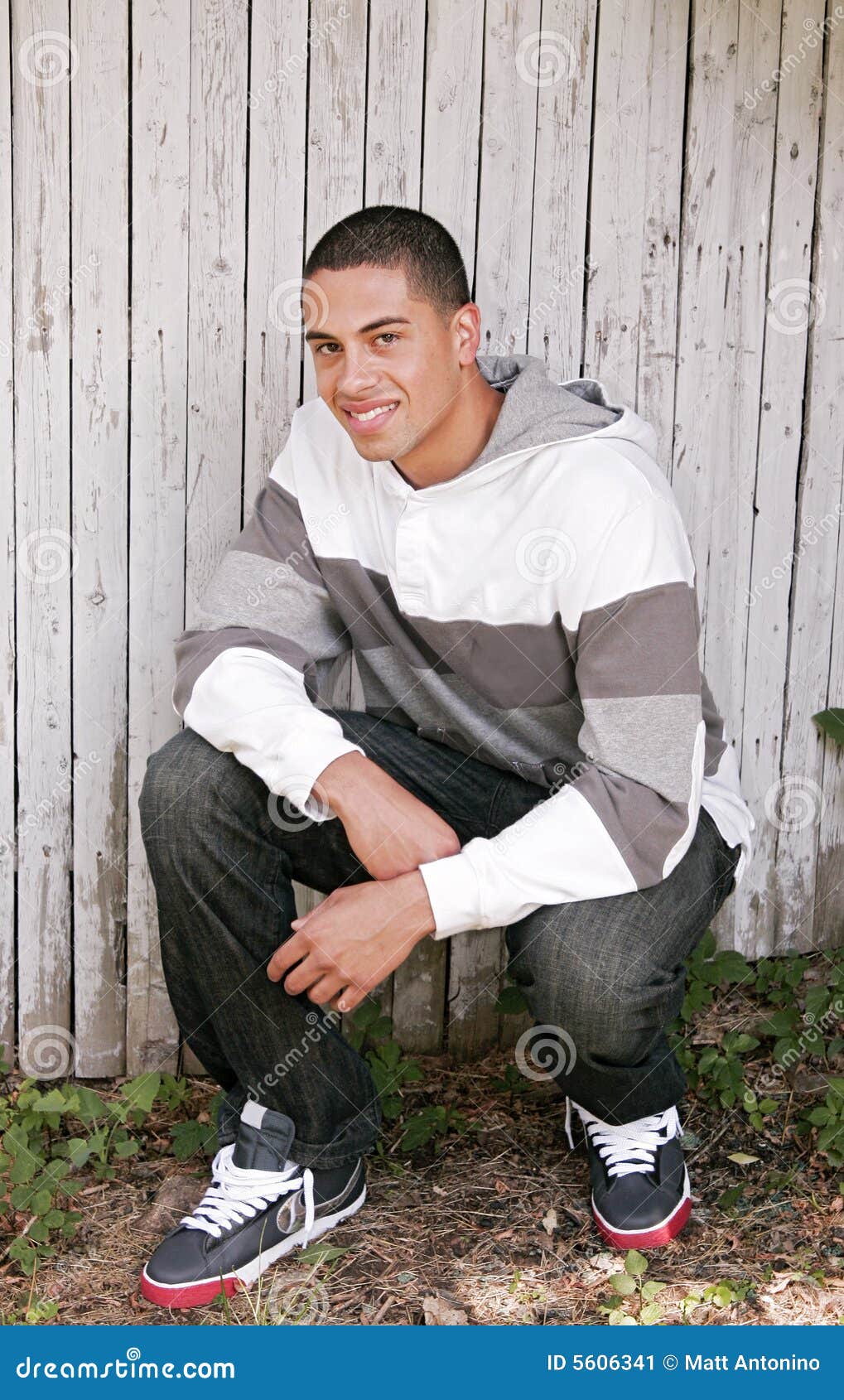 Guy squatting down stock image. Image of portrait, adult - 5606341