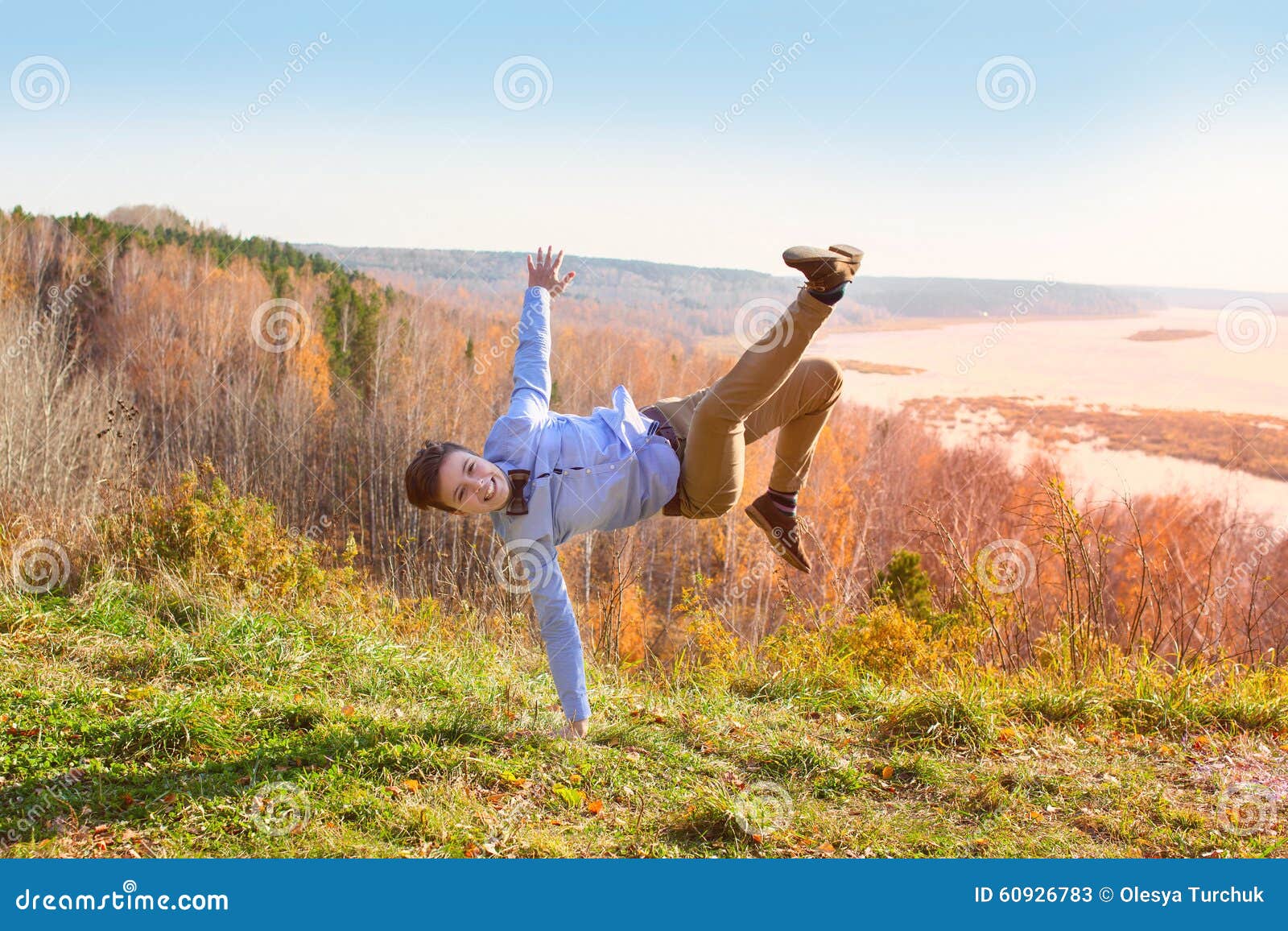 Guy standing on one hand stock image. Image of pants - 60926783