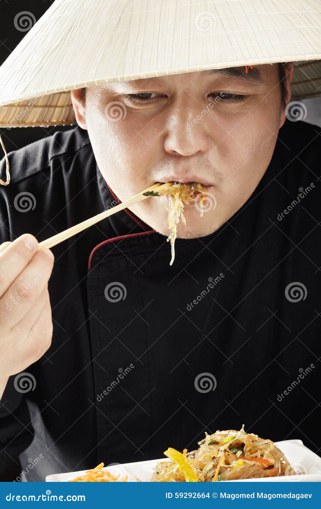 Guy in straw hat eating stock photo. Image of eating - 59292664