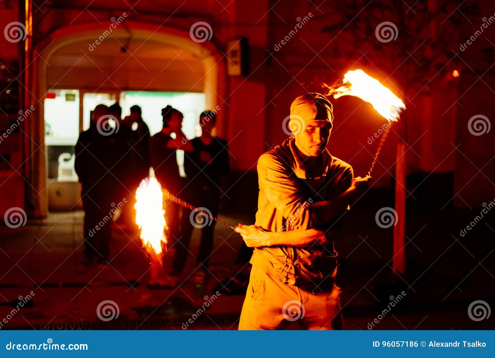 The Guy on the Street Performs with Fire Torches Stock Photo - Image of ...