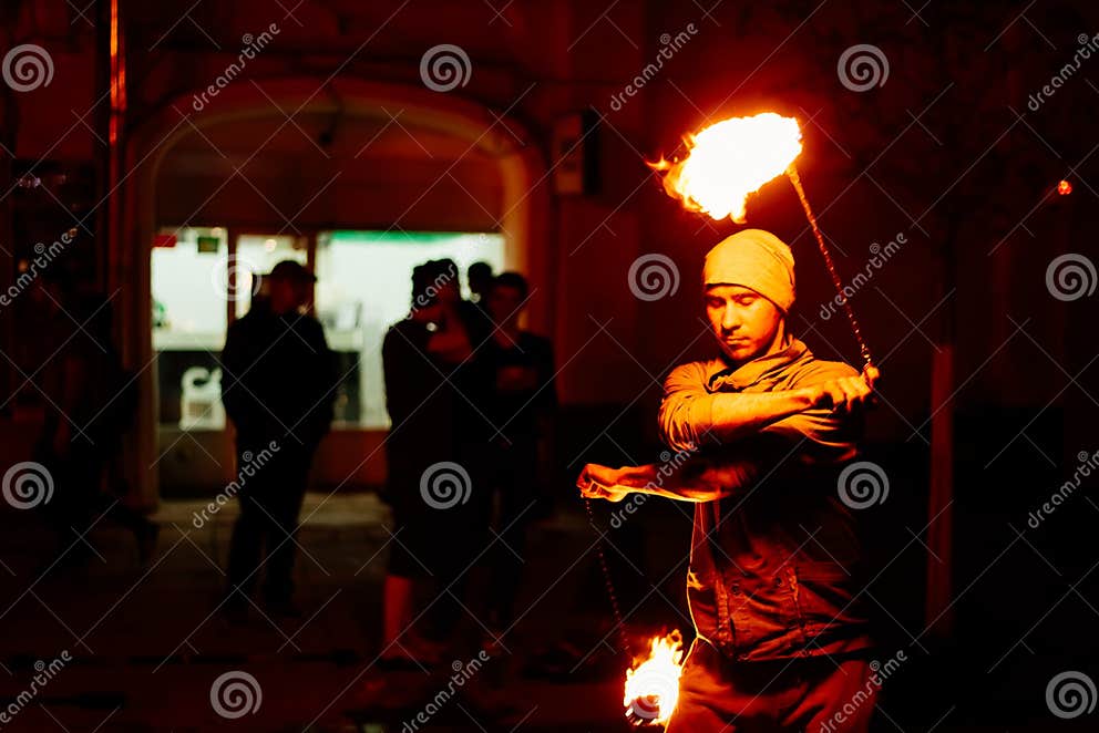 The Guy on the Street Performs with Fire Torches Stock Photo - Image of ...