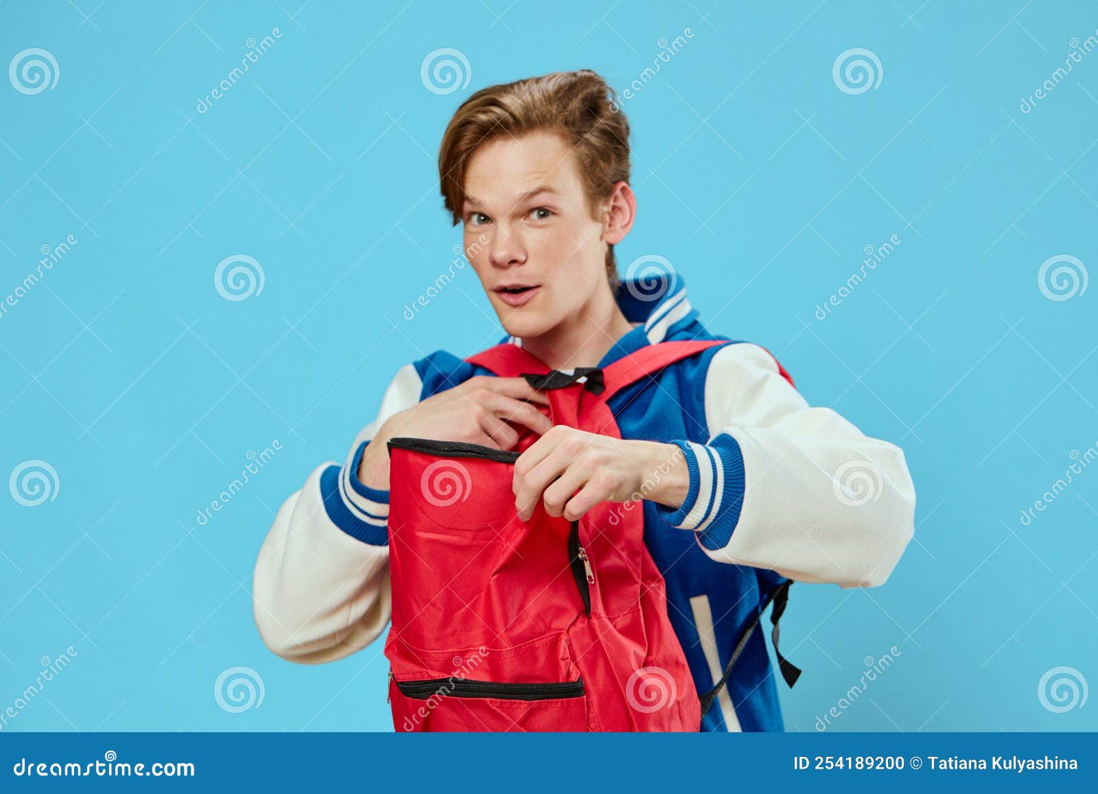 Guy Student with a Red Backpack Dressed Backwards Stock Photo - Image ...