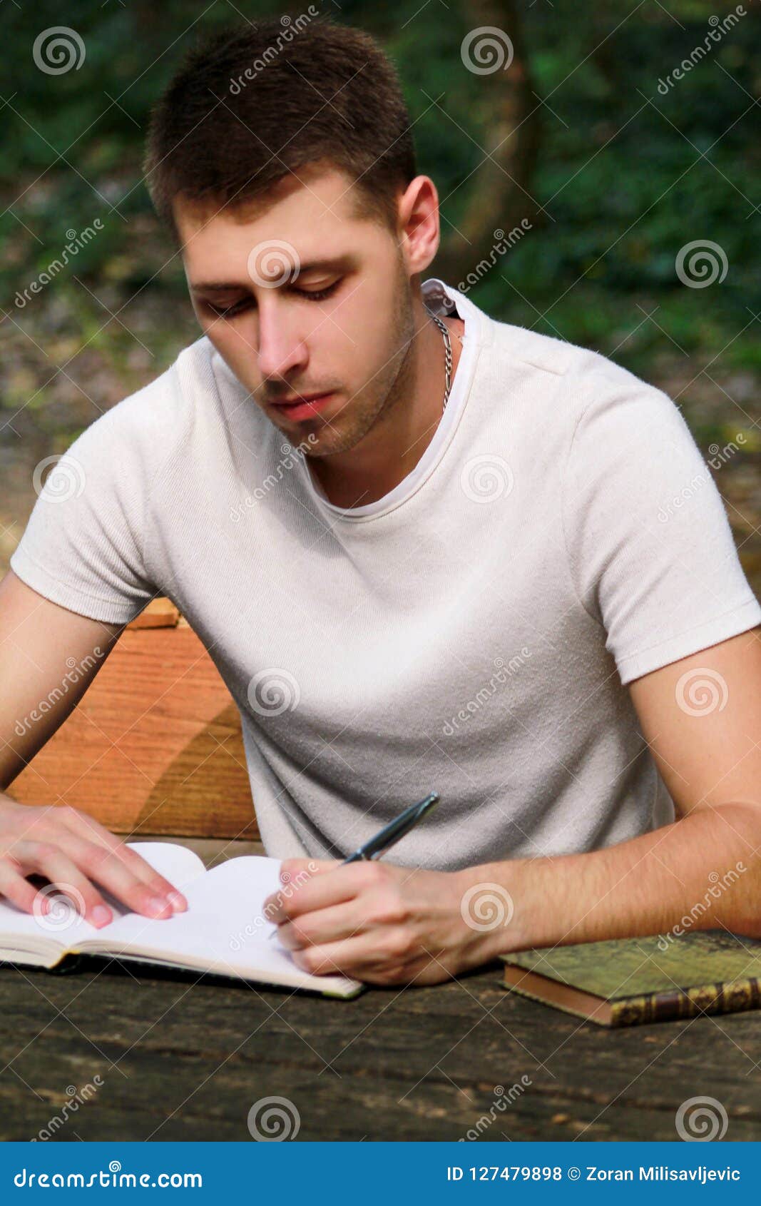 Guy and Student Takes Notes in Notebook, Learning and Writes Thoughts ...