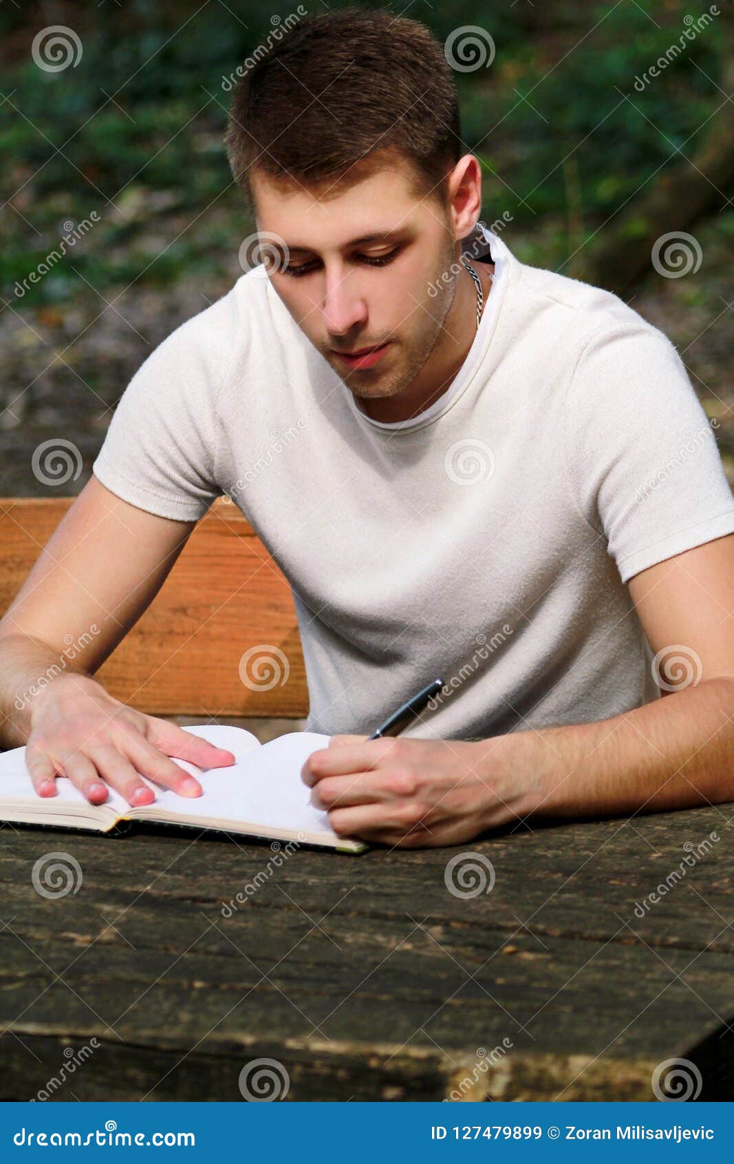 Guy and Student Takes Notes in Notebook, Learning and Writes Thoughts ...