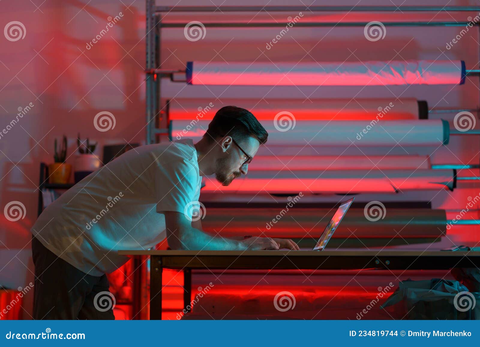Guy Stylist or Fashion Designer Work on Laptop in Studio. Tailor Use ...