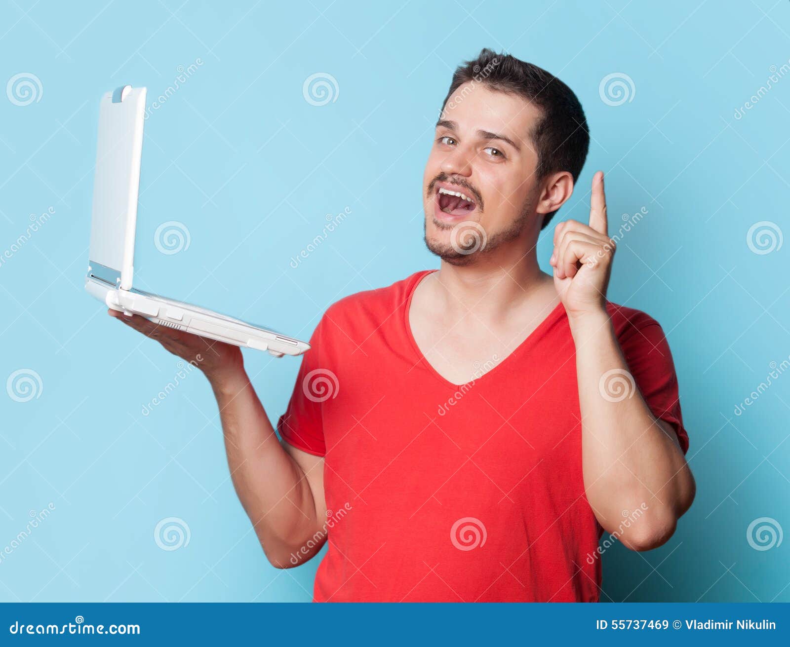 Guy in T-shirt with Laptop Computer Stock Image - Image of background ...