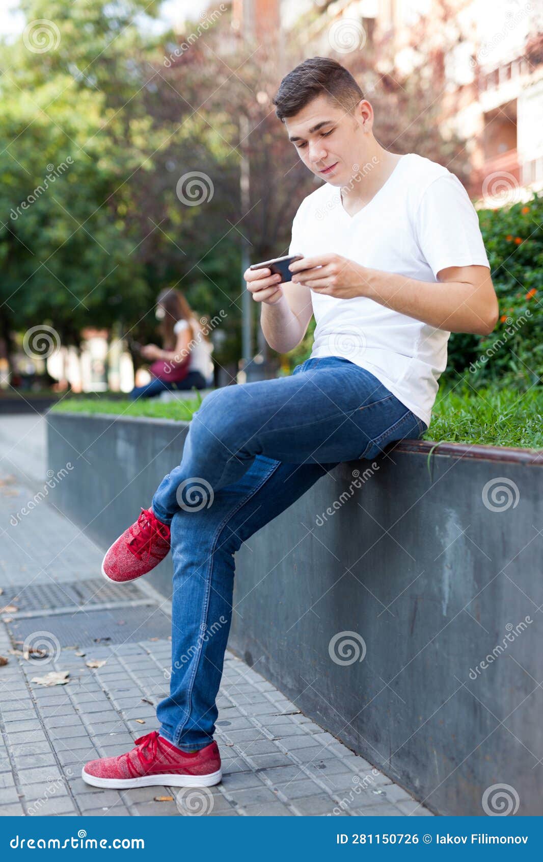 Guy Texting on His Smartphone in Park Stock Photo - Image of leisure ...