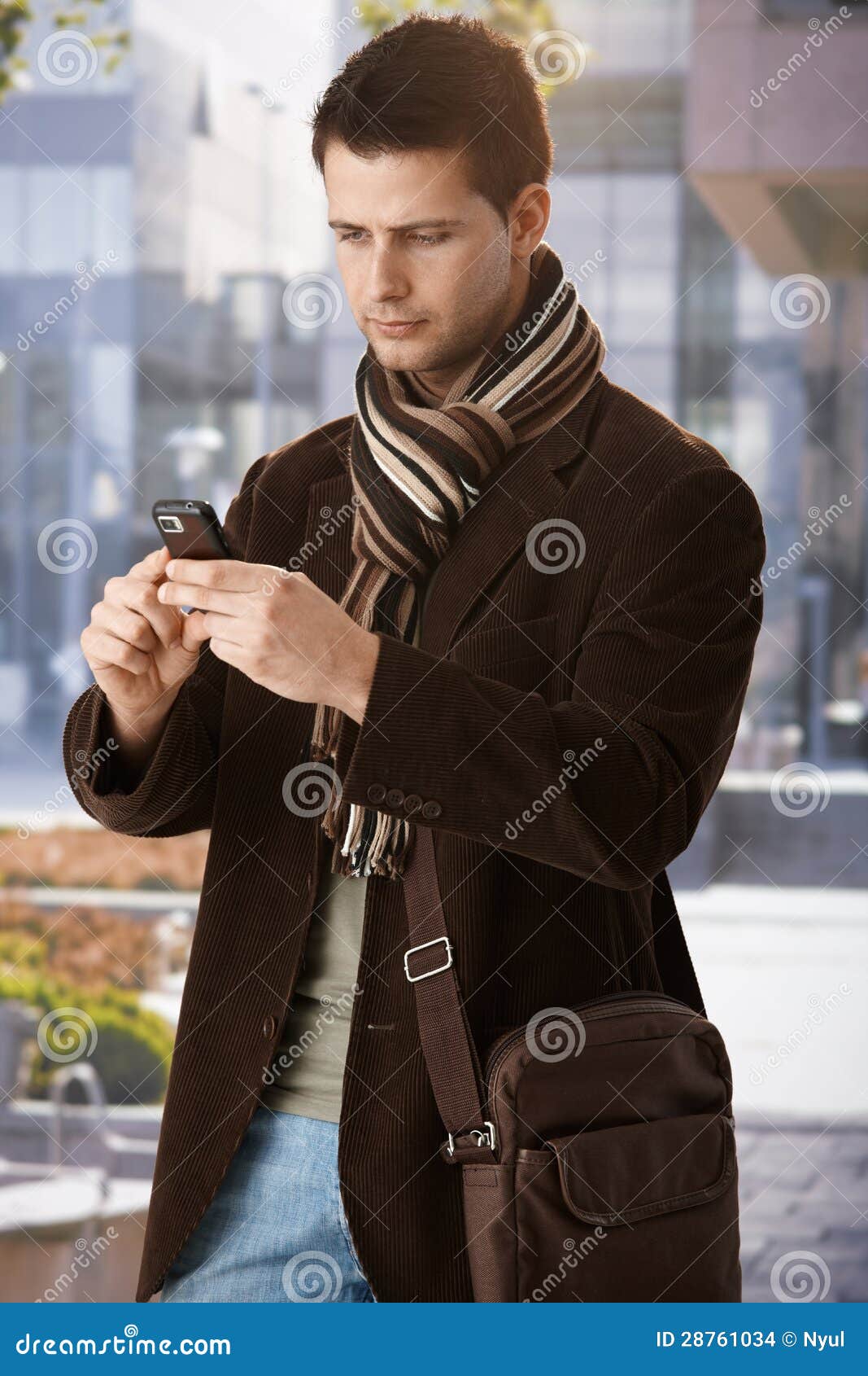 Guy Texting Outside of Building Stock Photo - Image of focusing, male ...