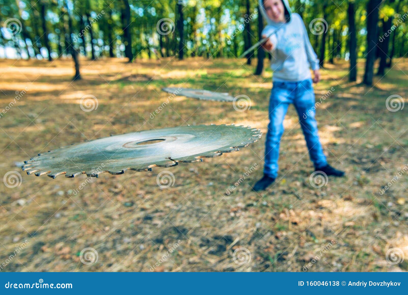 The Guy Throws a Circular Knife To Attack the Enemy in the Forest ...