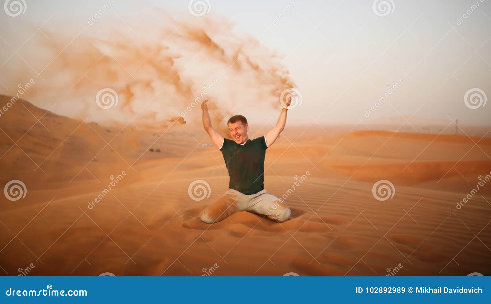 The Guy Throws Sand Over Himself in the Desert. the Desert is Next To ...