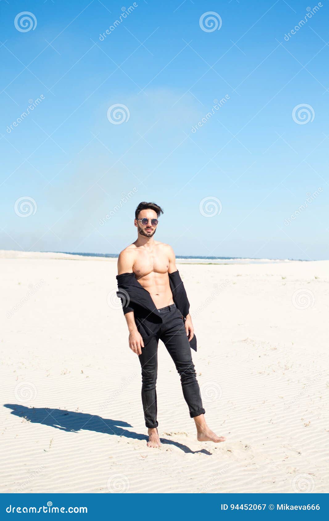 A Guy Throws Sand on the Sand on a Hot Summer Day Stock Image - Image ...