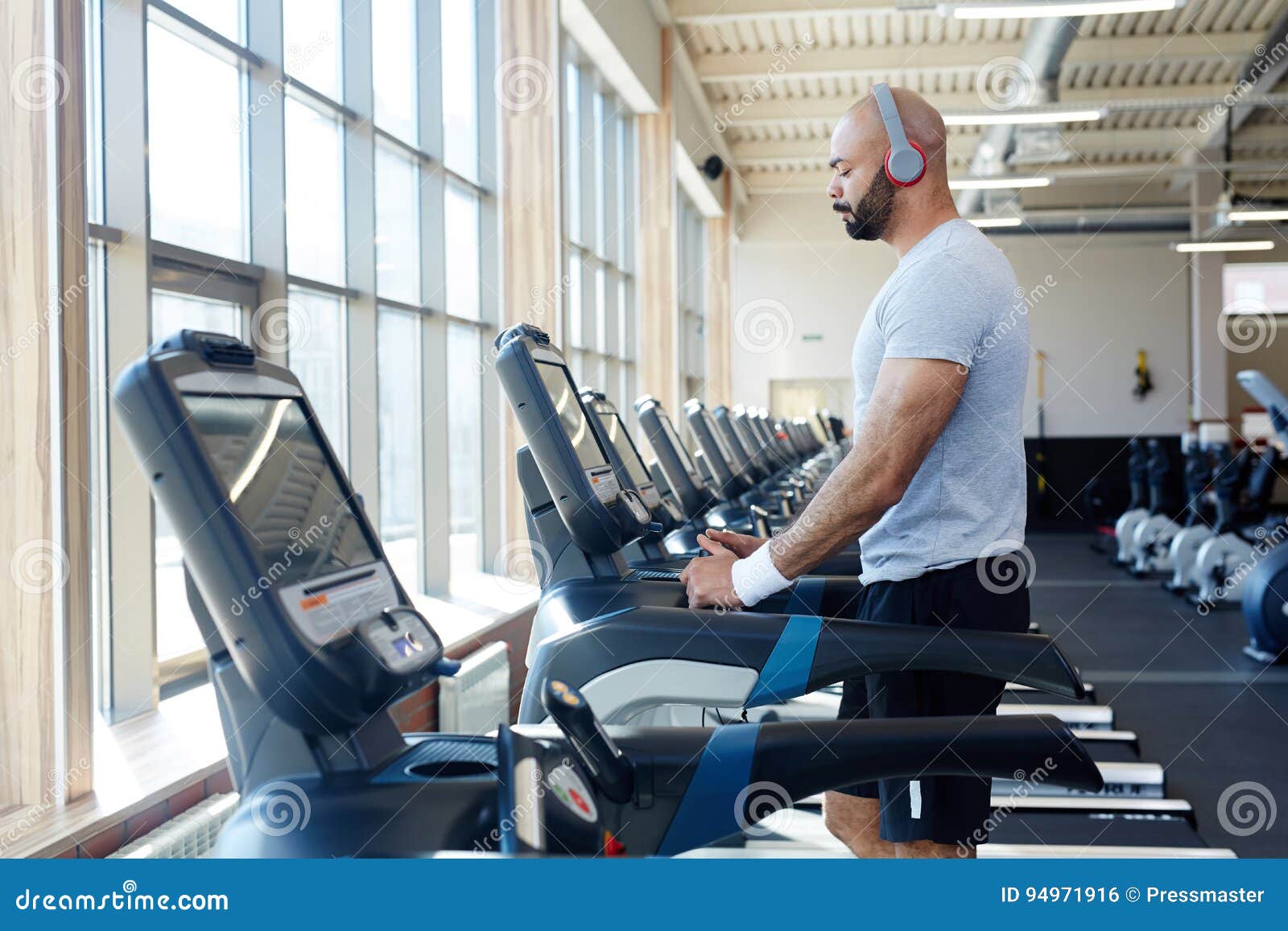 Guy on treadmill stock photo. Image of listening, practicing - 94971916