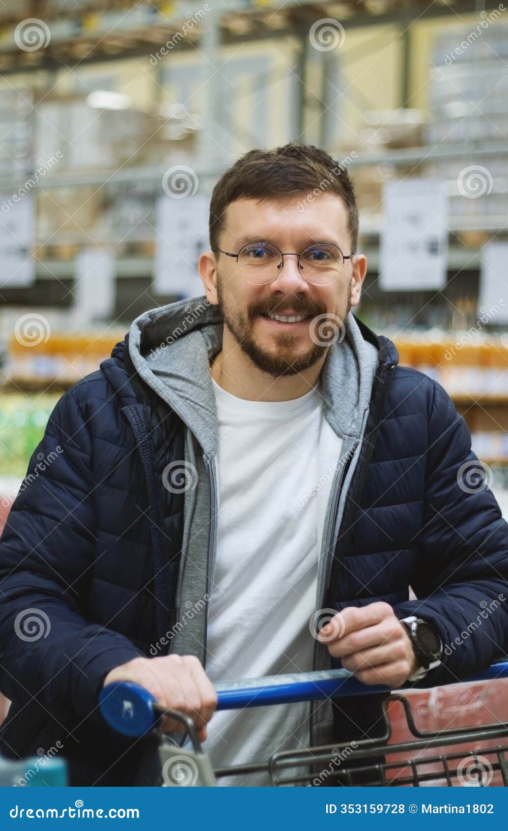 Guy with a Trolley in a Supermarket Stock Photo - Image of hypermarket ...