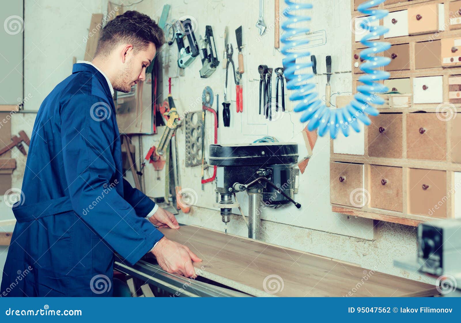 Guy Using Drilling Machine at Workshop Stock Photo - Image of neatness ...
