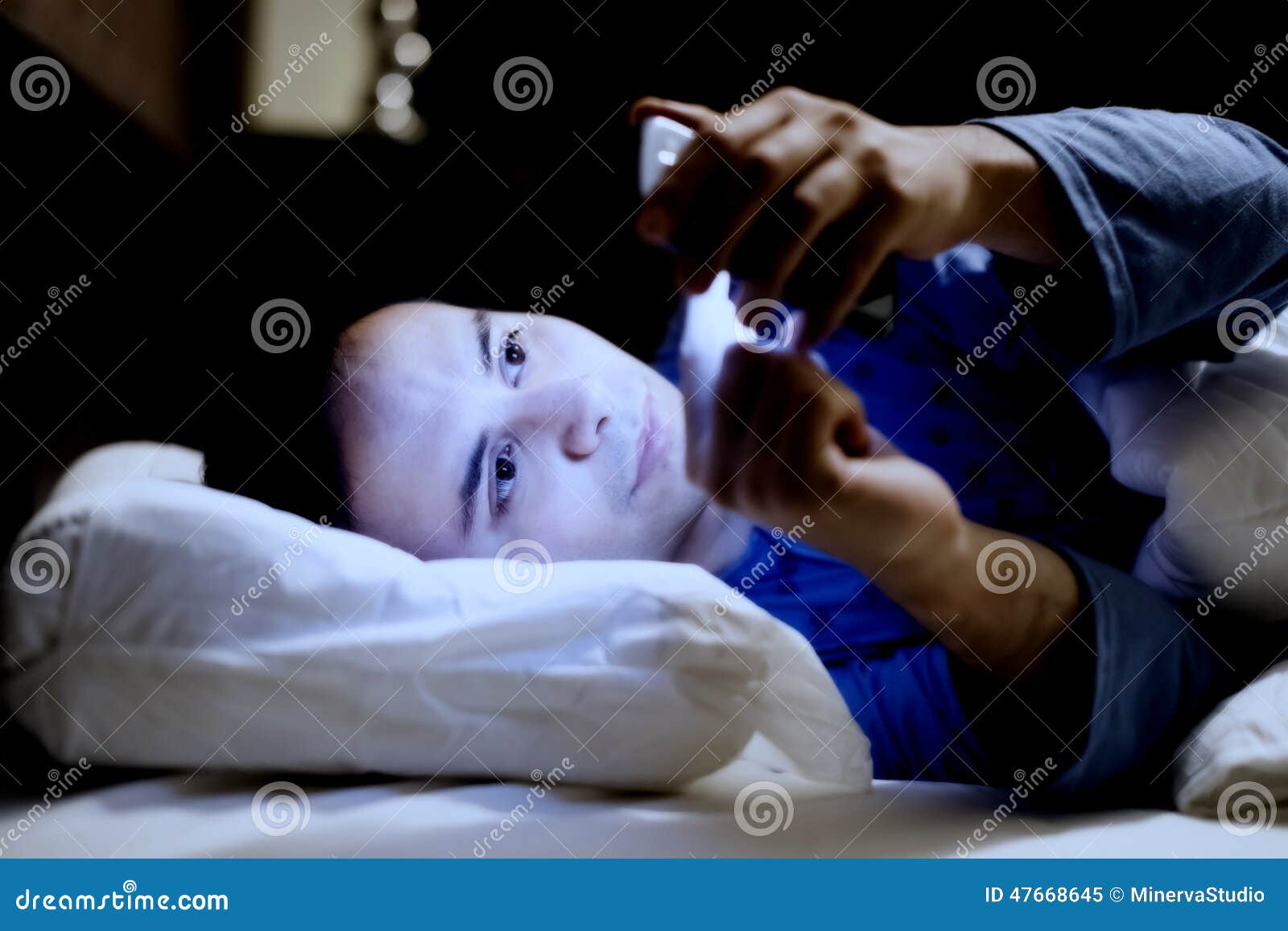 Guy Using His Mobile Phone in the Bed Stock Image - Image of male, open ...