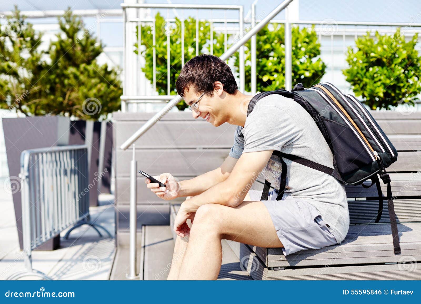 Guy using smartphone stock photo. Image of cell, laughing - 55595846