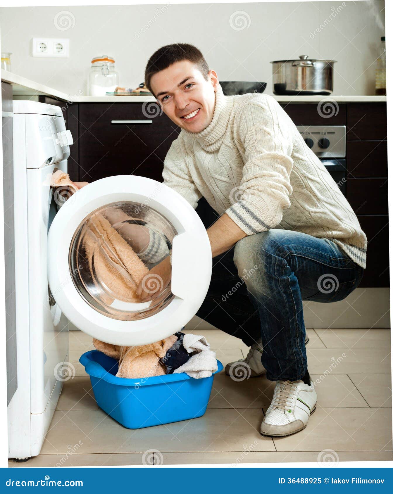 Guy using washing machine stock image. Image of laundry - 36488925