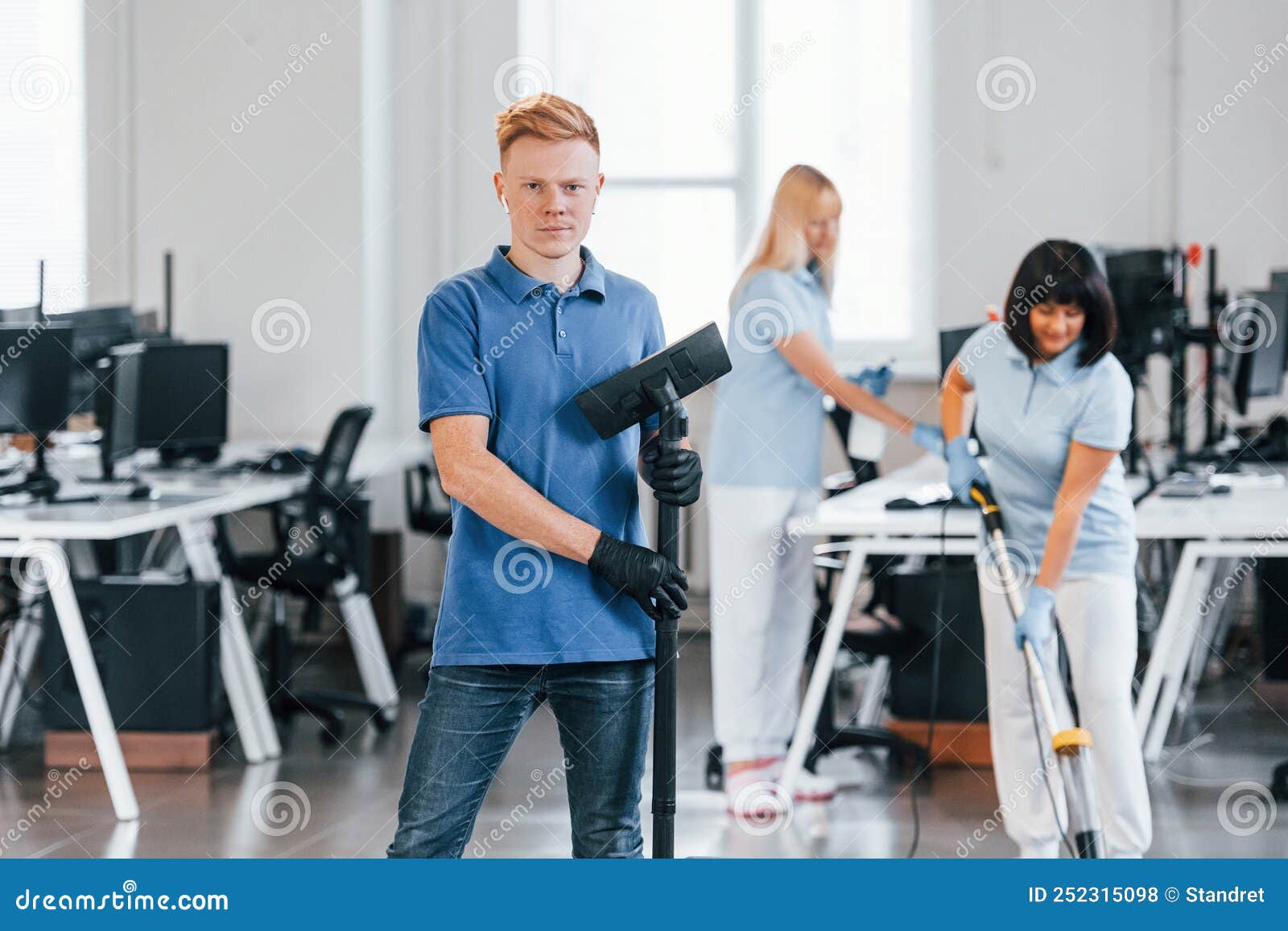 Two Cleaner Workers On Scaffolding Using Flat Mops To Cleaning White ...
