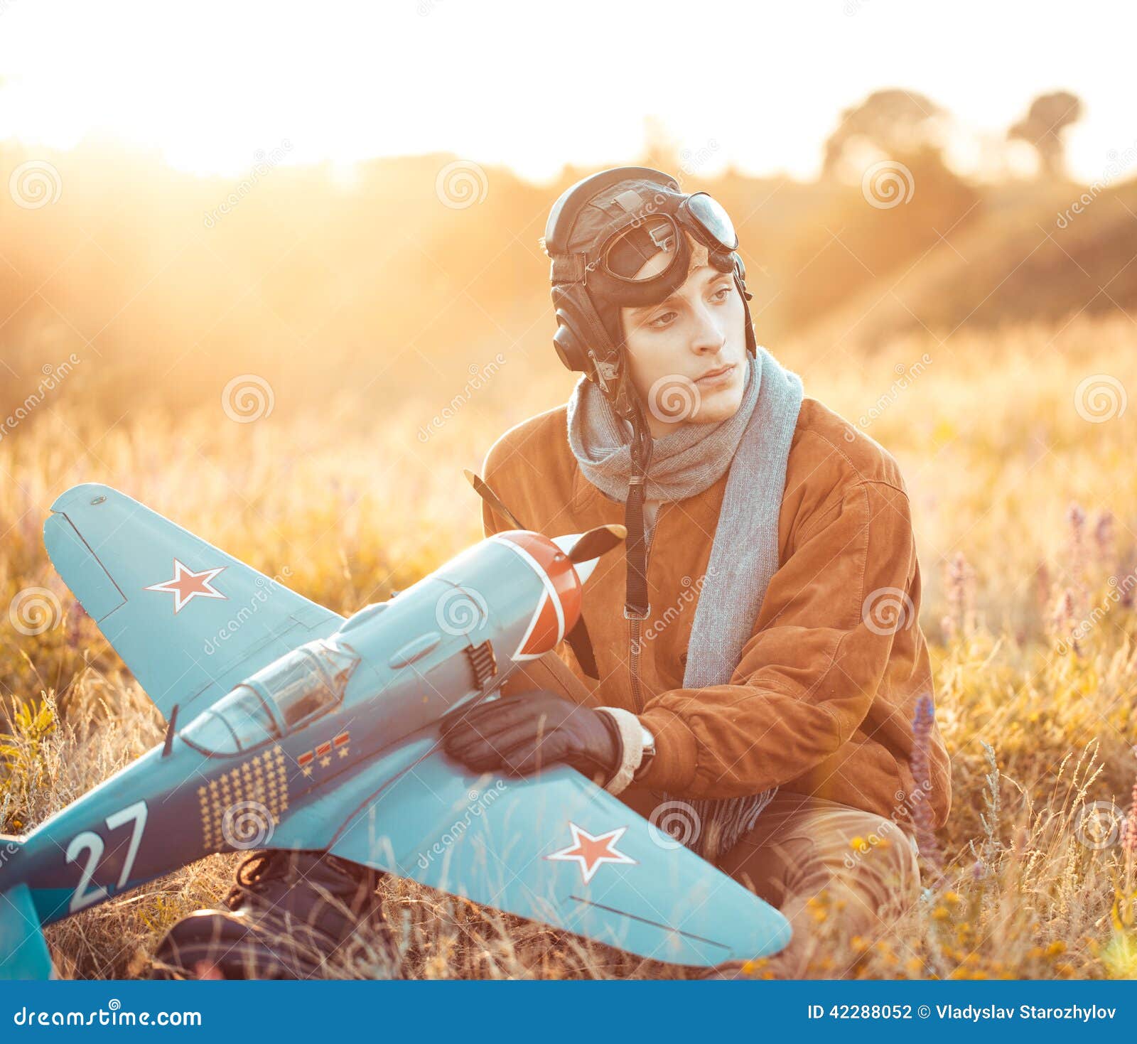 Guy in Vintage Clothes Pilot with an Airplane Model Outdoors Stock ...