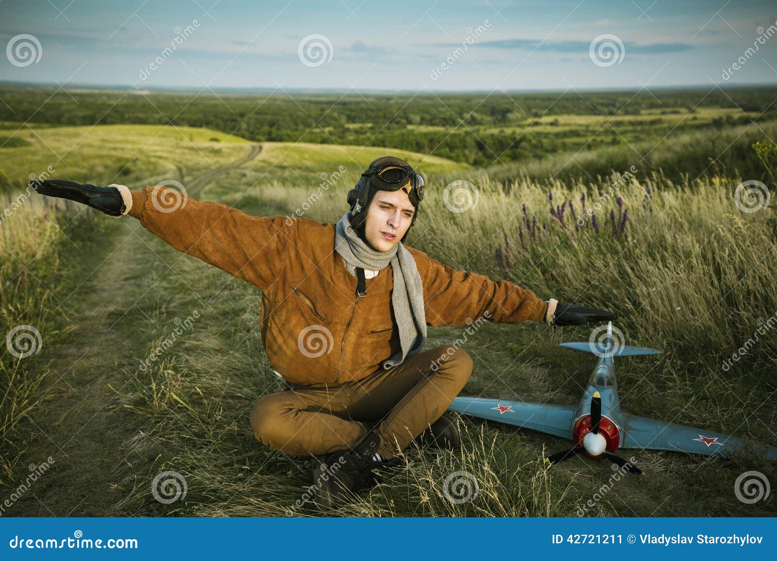 Guy in Vintage Clothes Pilot with an Airplane Model Outdoors Stock ...
