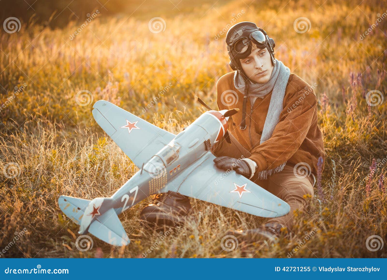 Guy in Vintage Clothes Pilot with an Airplane Model Outdoors Stock ...
