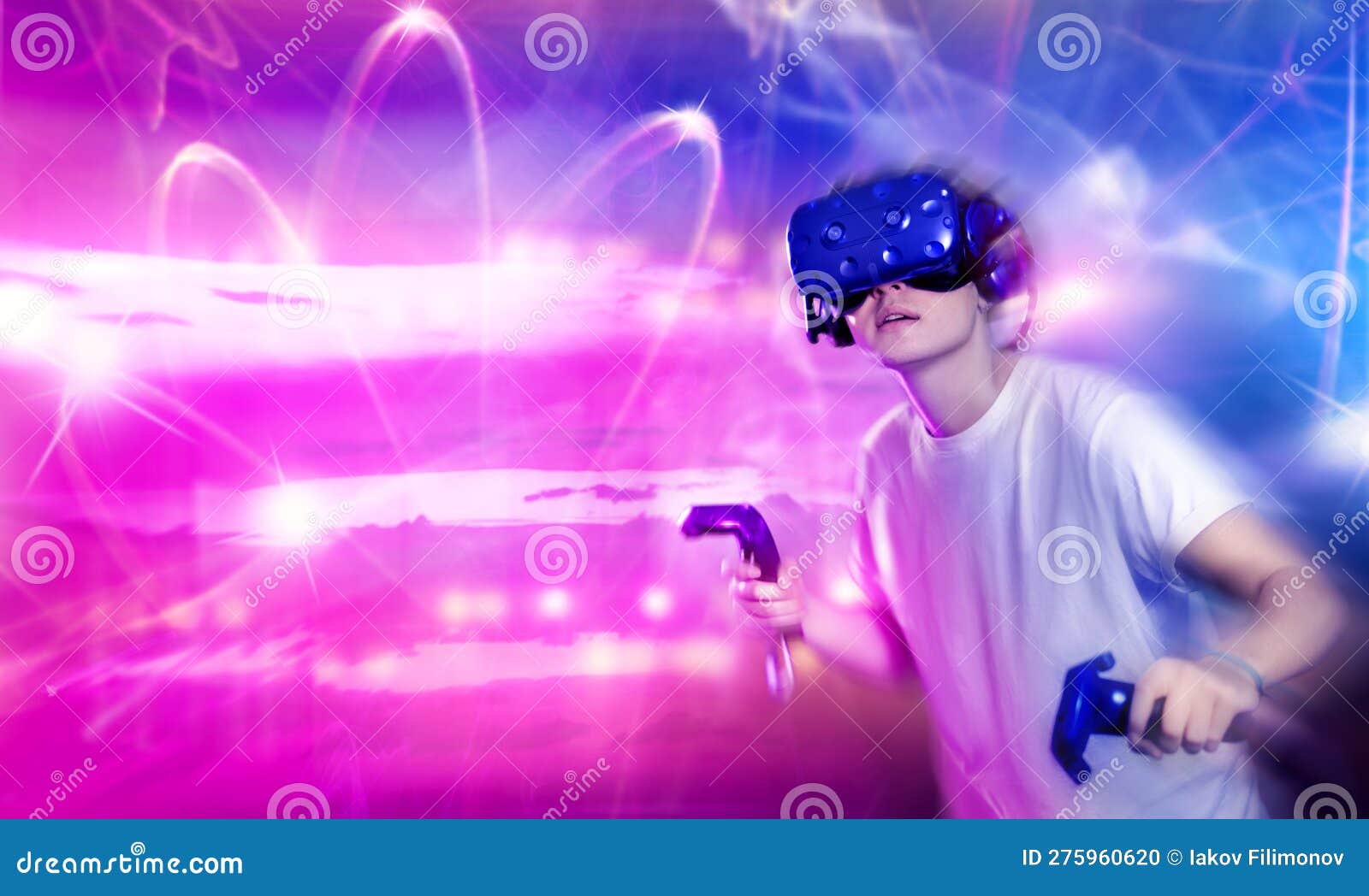 Guy in VR Headset with Handheld Controllers on Colorful Background ...
