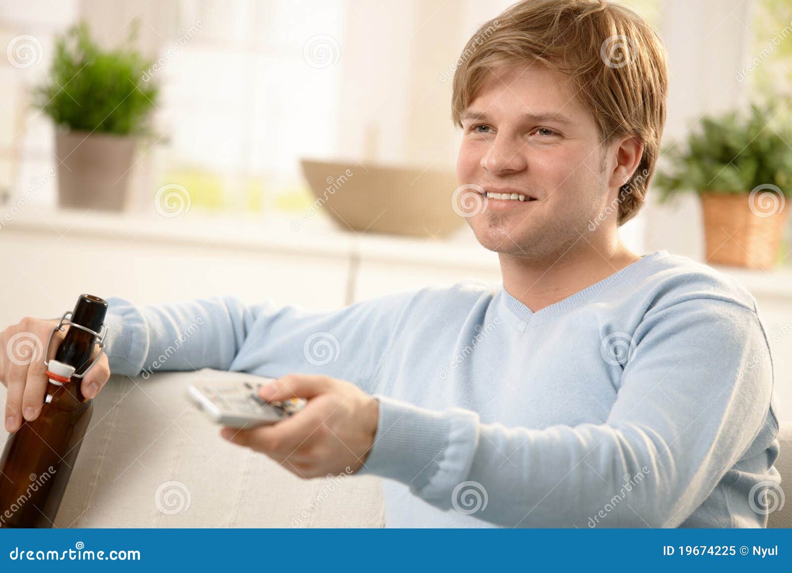 Guy watching tv stock image. Image of enjoying, caucasian - 19674225