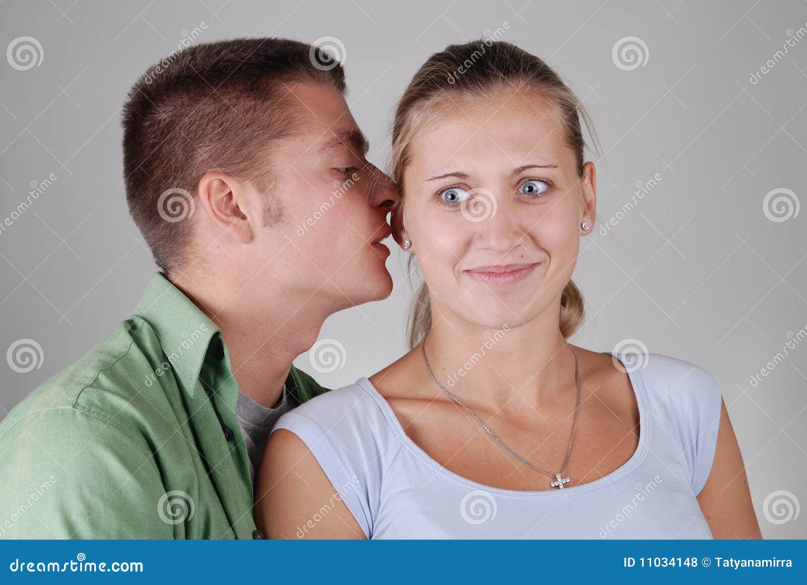 A Guy Whispering Something To a Girl Stock Photo - Image of eyes ...