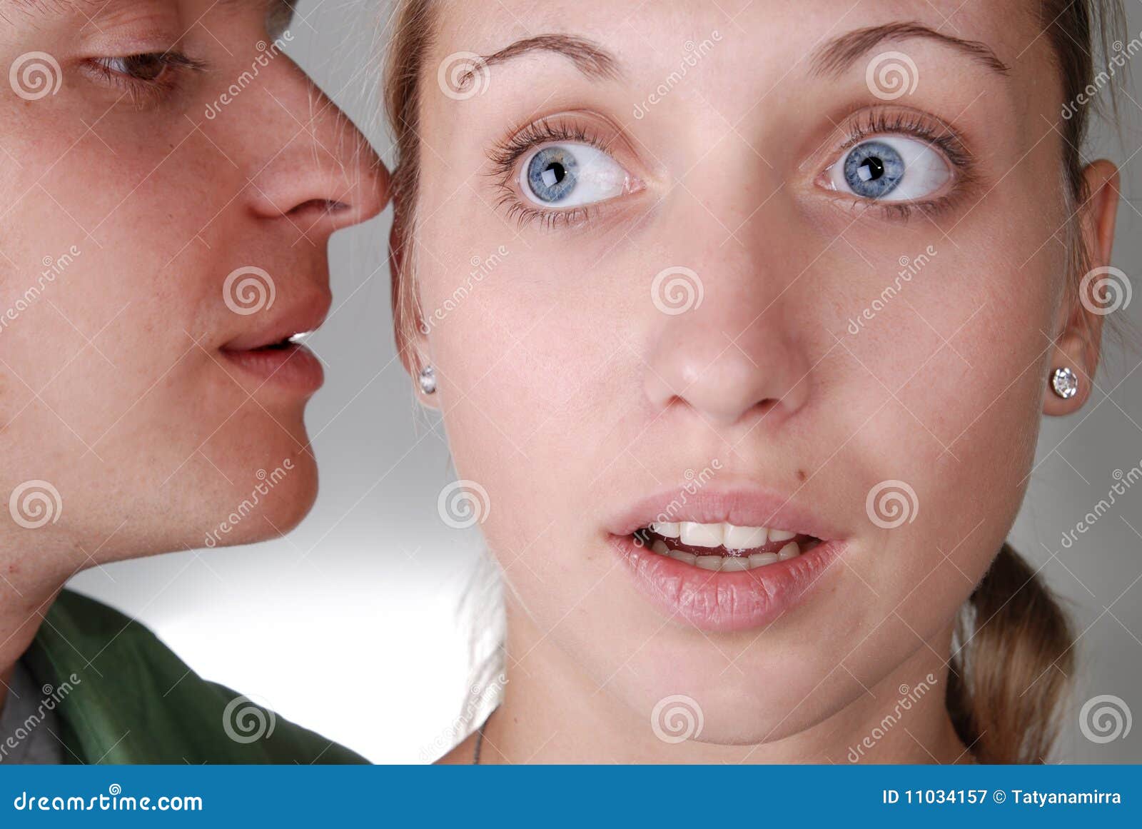 A Guy Whispering Something To a Girl Stock Image - Image of shirt ...