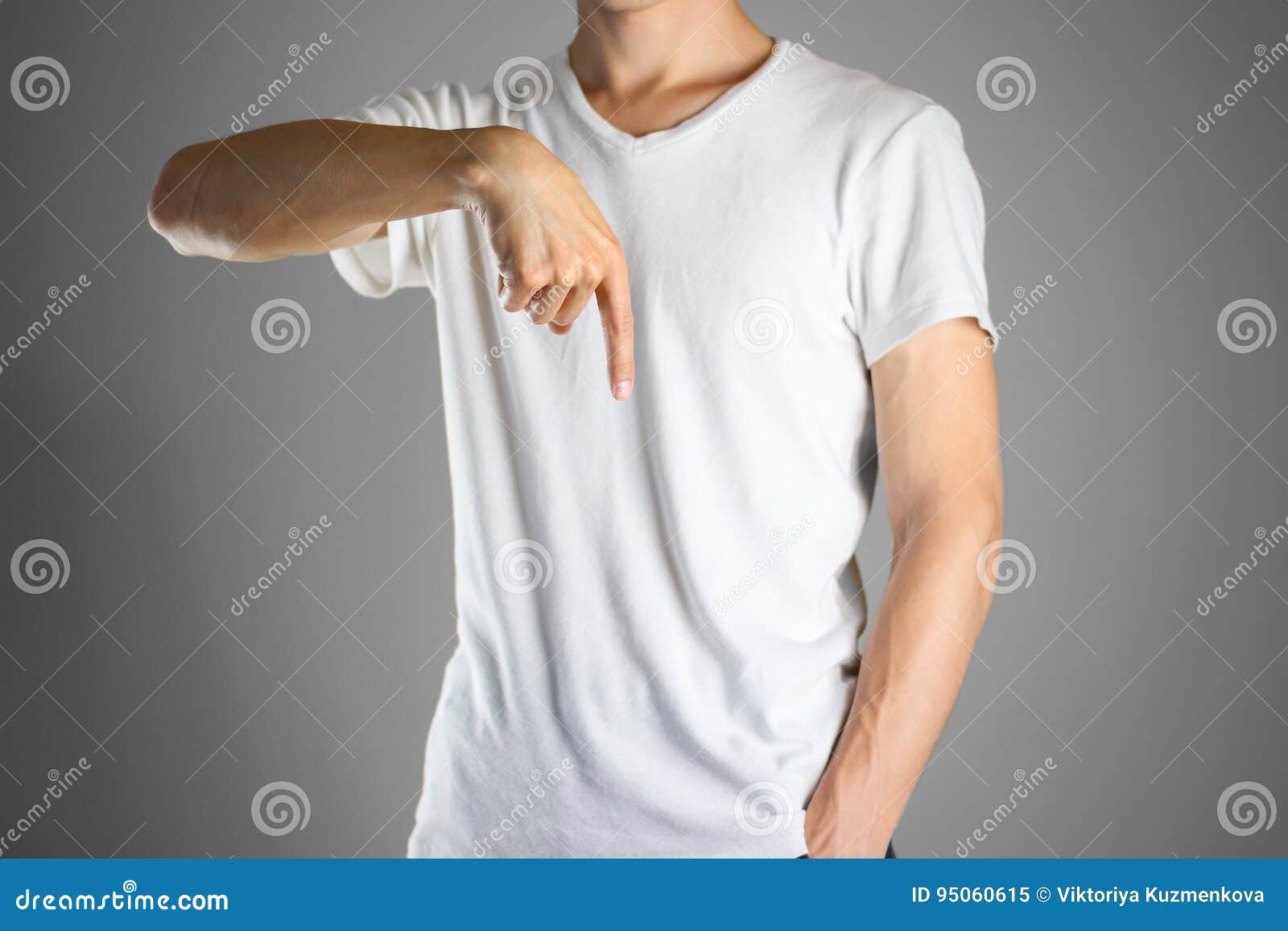 The Guy in White T-shirt Pointing Finger Down. Specifies the Dir Stock ...