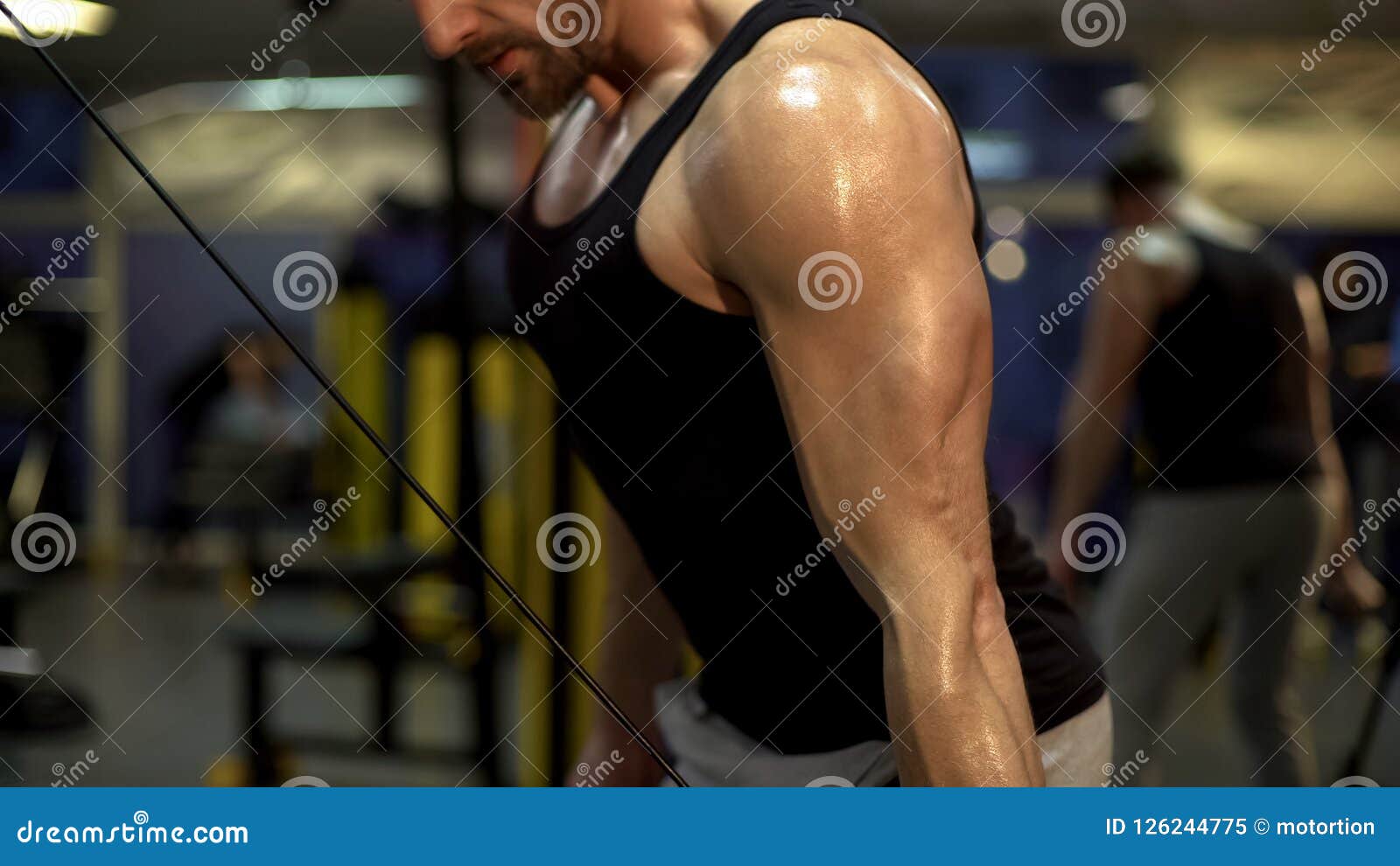 Guy Working Hard in Gym Doing Brisk Pull-downs with One Arm, Finishing ...