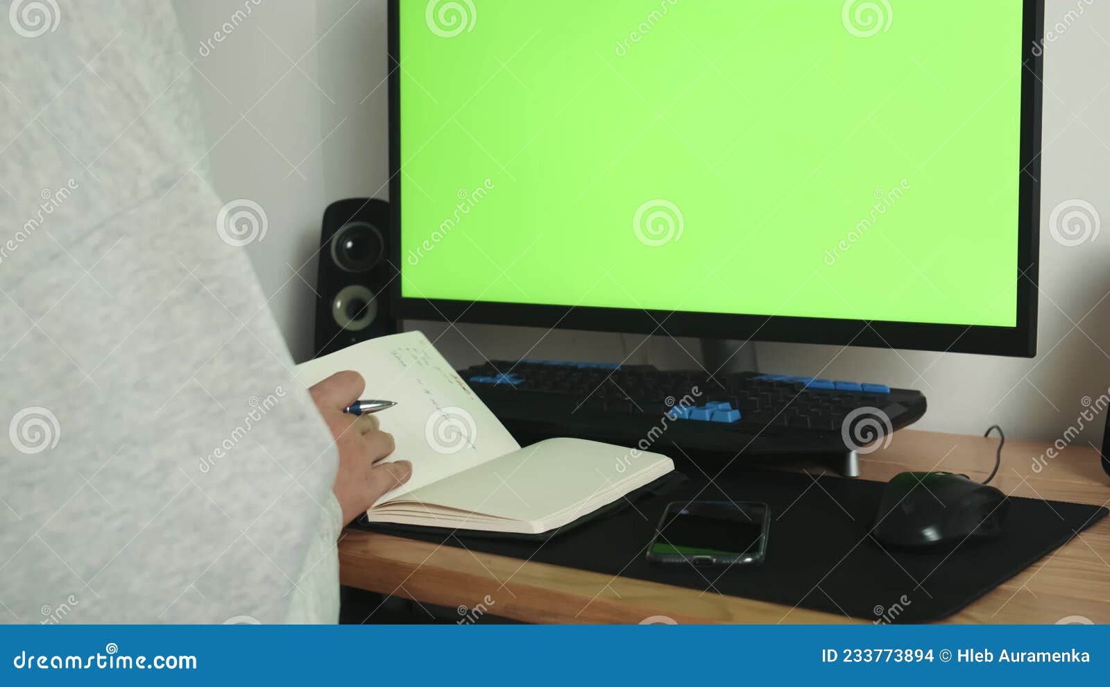 The Guy Works from Home Using a Computer with a Green Screen and Writes ...