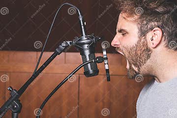 Guy Yelling at a Microphone Stock Photo - Image of performance, concert ...