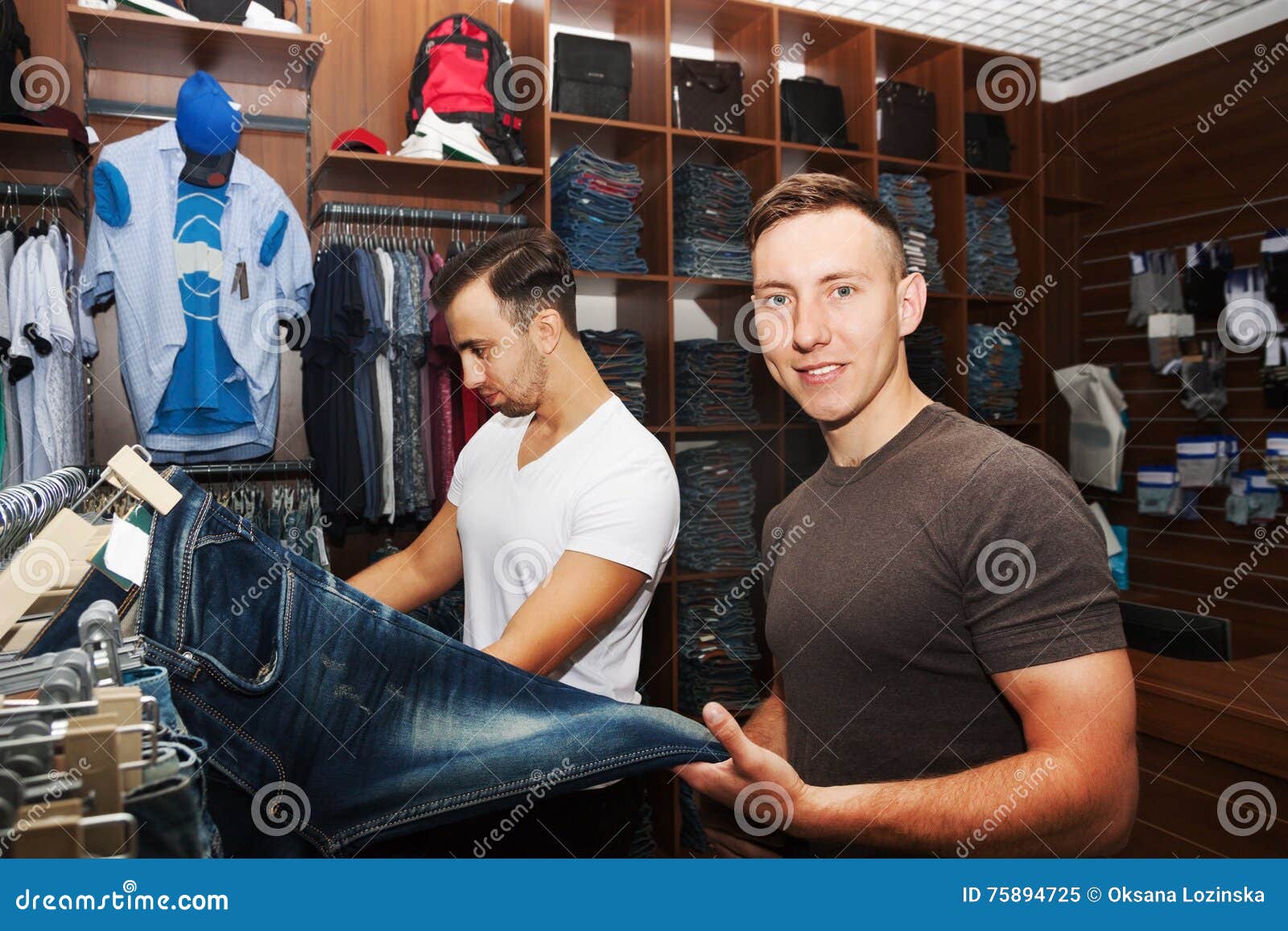 Guys in a clothing store stock image. Image of happy - 75894725