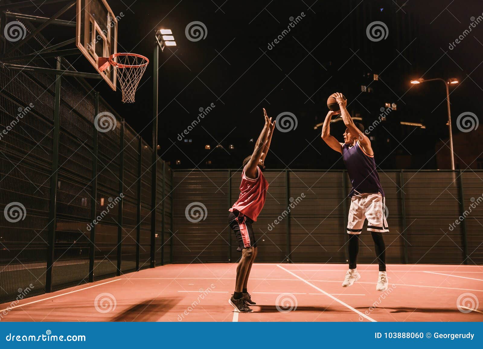 Guys playing basketball stock photo. Image of defending - 103888060