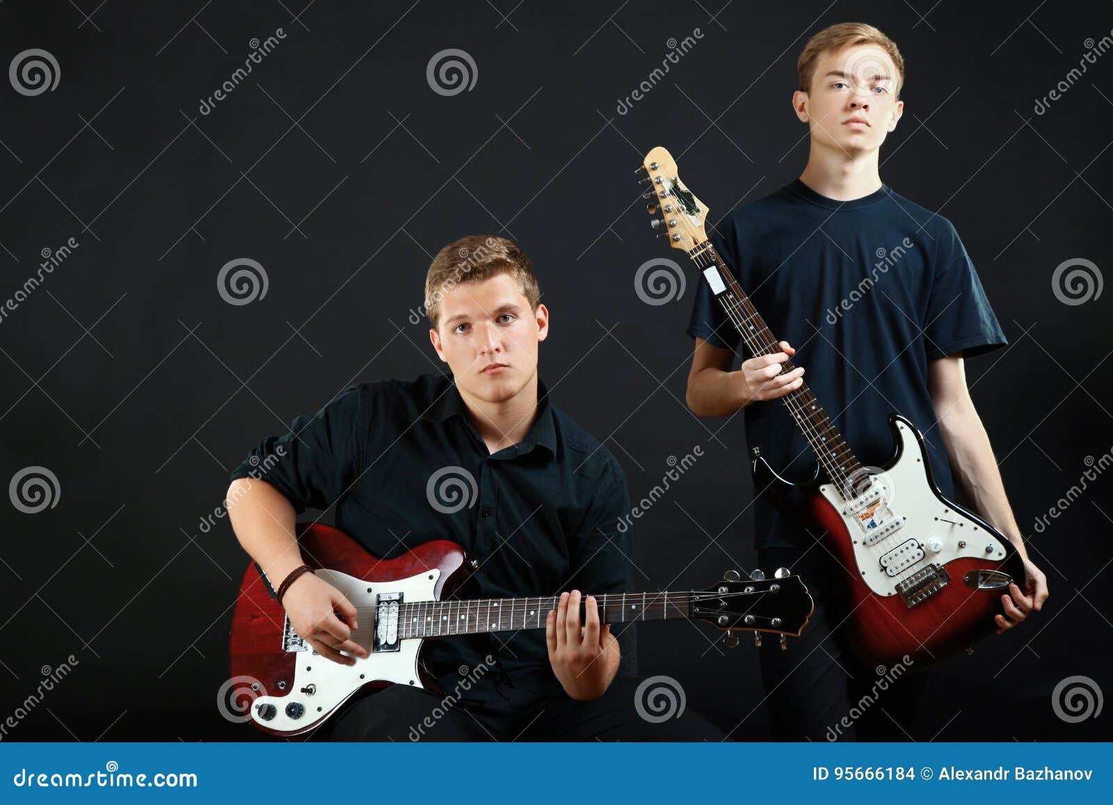 Guys Playing Electric Guitars Stock Photo - Image of stringed, guitars ...