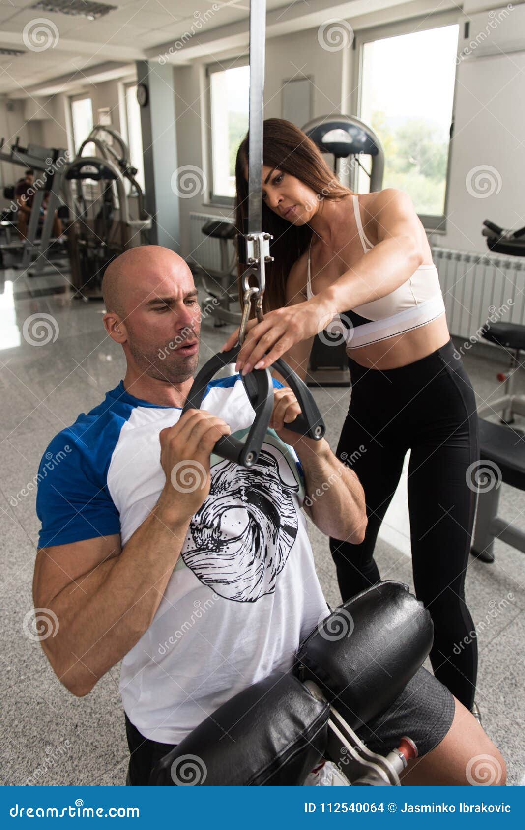 Gym Coach Helping Man on Back Stock Photo - Image of handsome, human ...