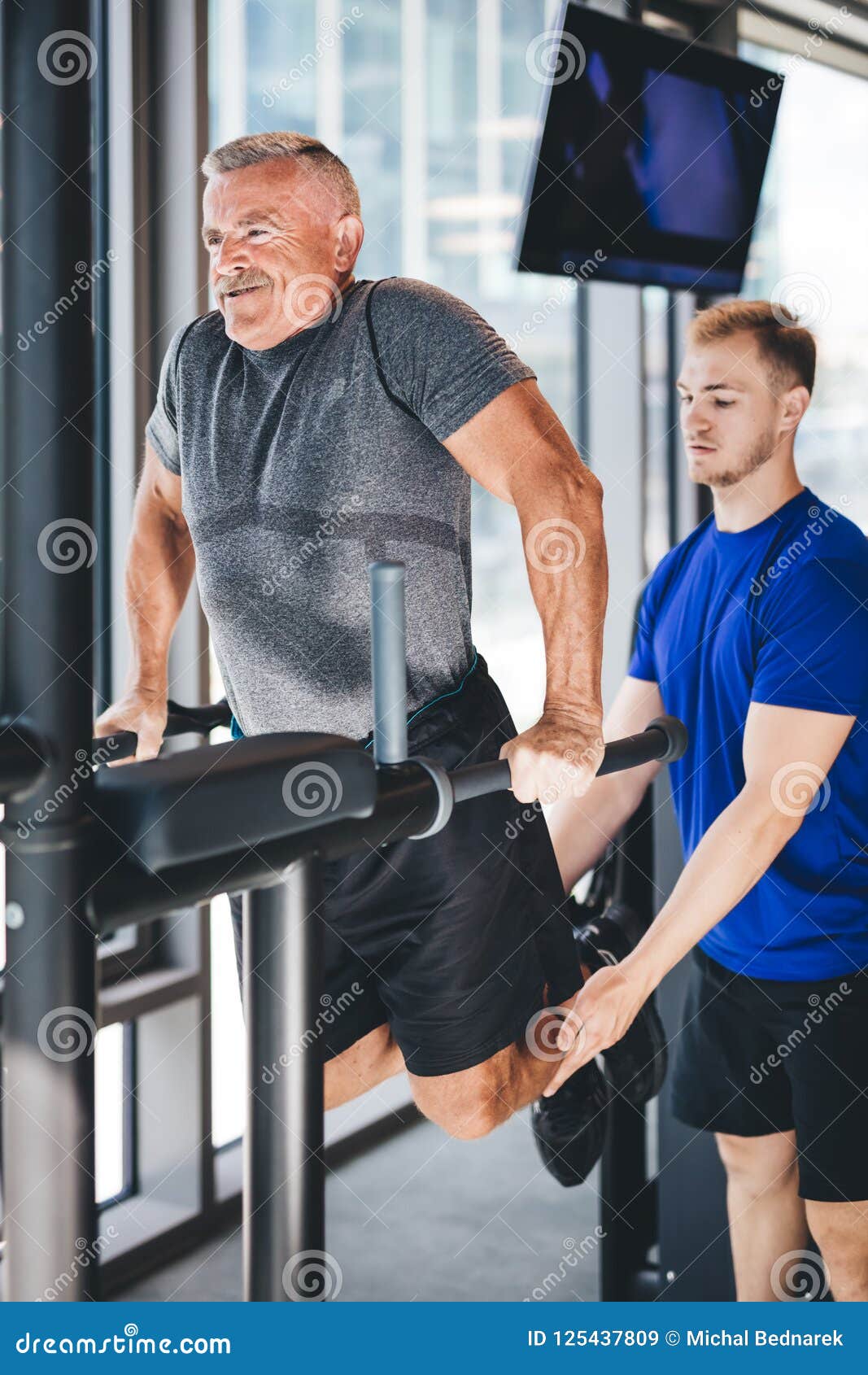 Gym Instructor Helping Senior Man at the Gym. Stock Image - Image of ...