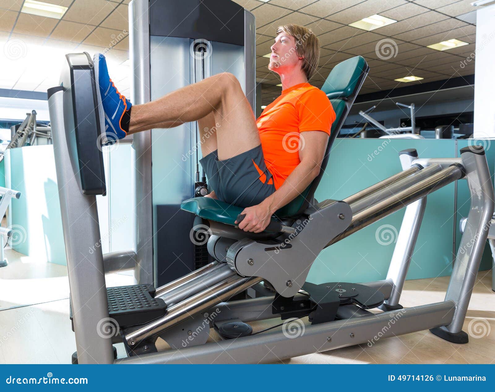 Gym Seated Leg Press Machine Blond Man Workout Stock Photography ...