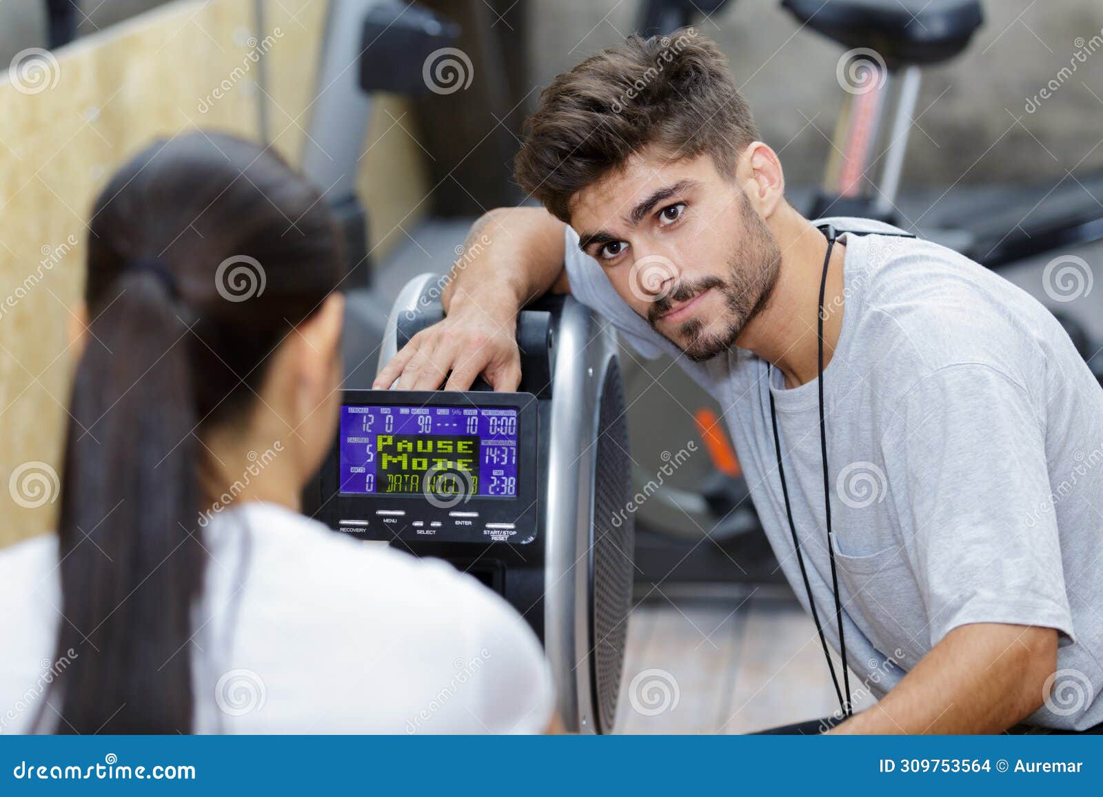 Gym Training Instructor Guiding Client on Using Equipment Stock Photo ...